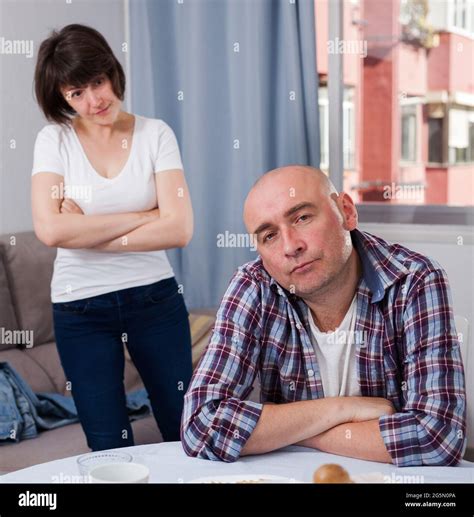 Domestic Quarrel Between Offended Husband And His Wife At Home Stock
