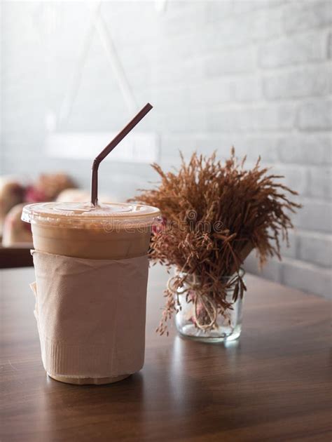 Iced Coffee With Straw In Plastic Cup On Wood Table Stock Image Image