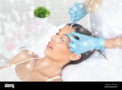 Cosmetologist Makes Rejuvenating Anti Wrinkle Injections On The Face Of