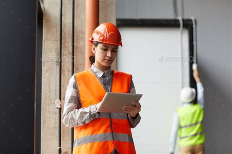 Tech Savvy Construction Worker On The Job