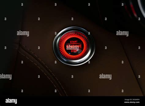 A Mercedes Amg Engine Start Stop Button Turned On Red In Brown