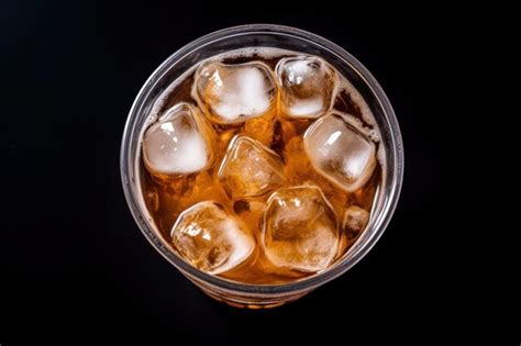 Premium Ai Image A Glass Of Ice Cubes With Ice Cubes On A Black