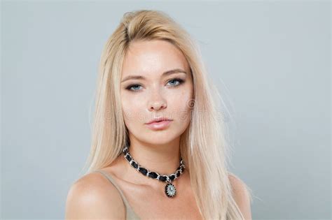 Blonde Model Woman With Natural Make Up Healthy Skin And Long Hair