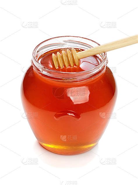 木勺和一罐蜂蜜。