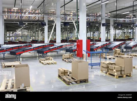 Big Empty Modern Workshop With Cardboard Boxes Conveyors For Sorting