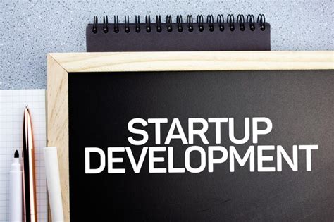 Premium Photo Startup Development Text On Chalkboard Development Of A