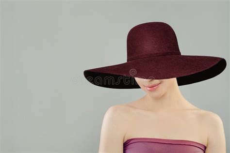 Beautiful Young Happy Woman With Clean Fresh Skin In Burgundy Wide Hat