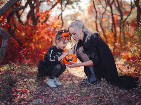 Young Girl In Black Cat Costume Goes Trick Or Treating Stock Image