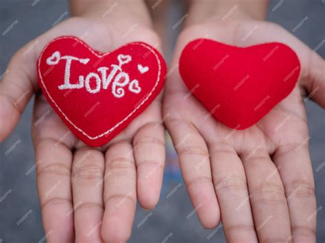 Premium Photo Cropped Hands Of Person Holding Heart Shapes