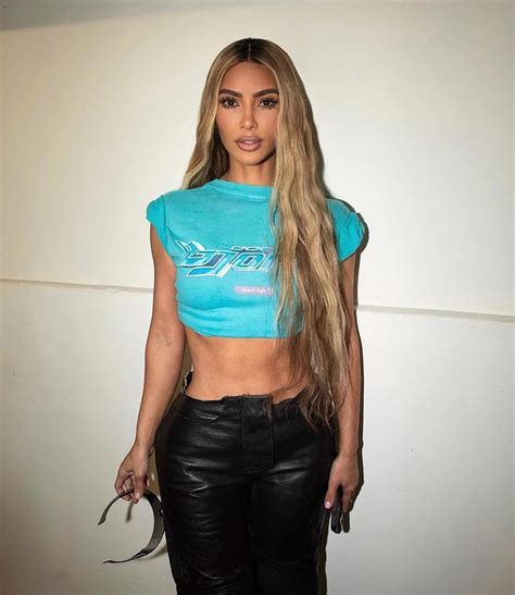 Kim Kardashian Looks Back At Her Butt In Silver Skims Bikini
