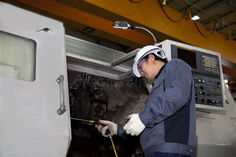 Worker Operating Cnc Machine Center Stock Photo Image Of Automated