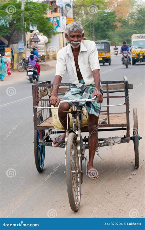 Indian Man Driving Bicycle Rickshaw At Crowded City Street Editorial