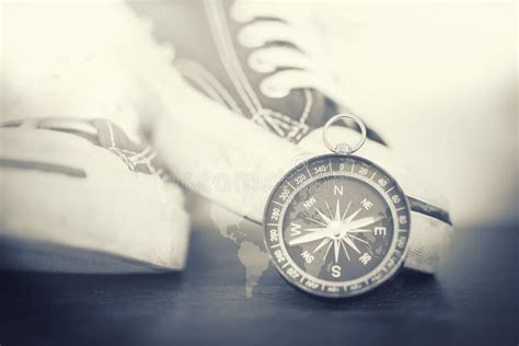 Double Exposure Of Compass Shoes And World Map Travel Concept Stock