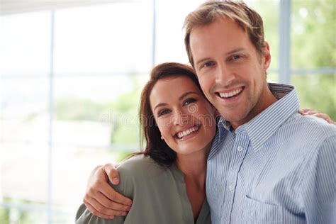 Keeping Her Close Cropped Portrait Of An Affectionate Young Couple At