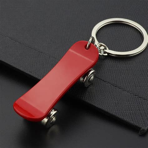 Quality Mini Skateboard Keychain With Spinning Wheels