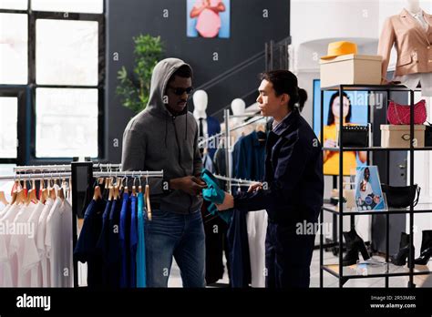 Asian Worker Caught Robber Trying To Steal Fashionable Clothes From