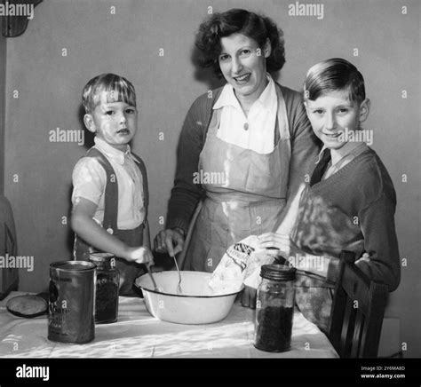 Mrs Venton And Her Sons Kenneth And Colin Making The 15th Anniversary Cake For Her Husband