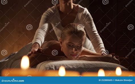 Young Healthy And Beautiful Woman Gets Massage Therapy In The Spa
