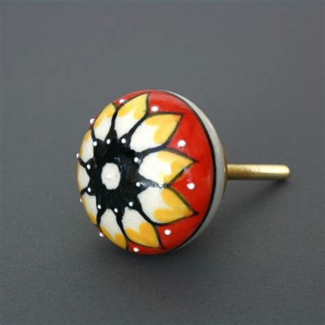 Elegant Embossed Ceramic Cabinet Knob With Blue Yellow And Red Floral Design And Hints Of White