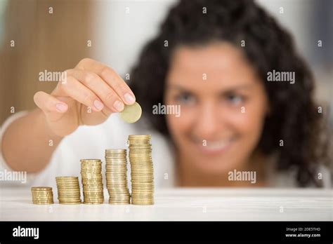 Picture Of Woman Stacking Up Coins Stock Photo Alamy