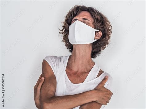 Lonely Sad And Depressed Woman Wearing A White Medical Face Mask