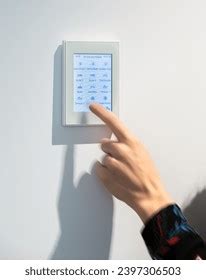 3 Hundred Woman Adjusting Temperature On Home Automation Device Royalty Free Images Stock