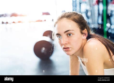 Young Fitness Girl With Dental Braces Feeling Exhausted After Hard