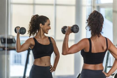 Healthy Strong Latina Female Holding Dumbbells Lifts Weights Exercise