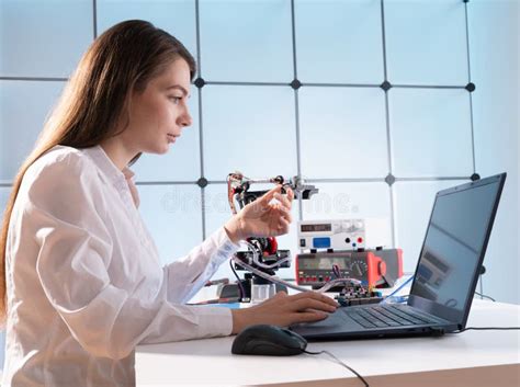 A Young Woman Writes An Algorithm For The Robot Arm Science Research