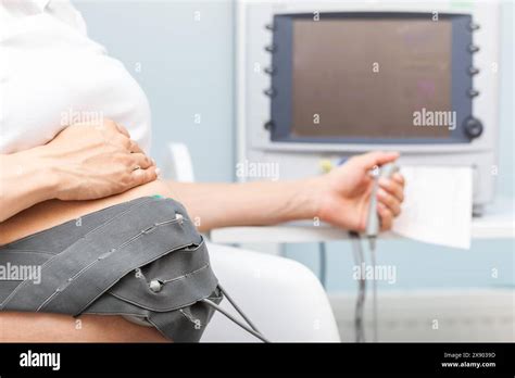 A Pregnant Woman Performing Cardiotocography Ctg To Monitor Fetal