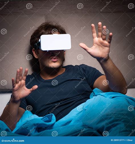 Young Man Playing Computer Games At Night In Bed Stock Image Image Of