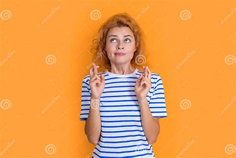 Wishing Redhead Woman Portrait Isolated On Yellow Background Portrait