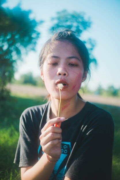 Premium Photo Young Woman Holding Flower