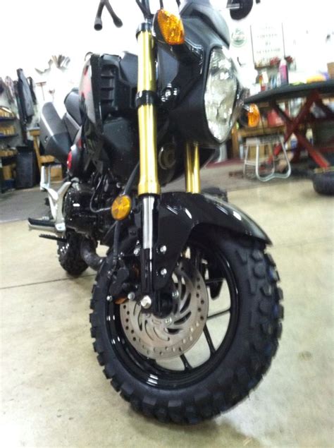 A Grom With Knobbies In A Garage