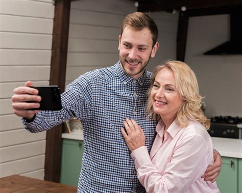 Free Photo Mom And Son Taking A Selfie In The Kithen