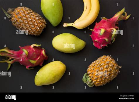 Tropical Fruits Pineapple Banana Dragon Fruit And Mango On Black