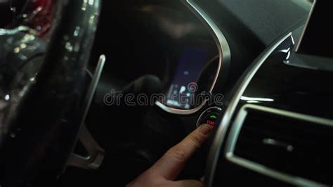 Switching On The Ignition Of Vehicles The Man Presses The Start Button In The Car Engine Stock
