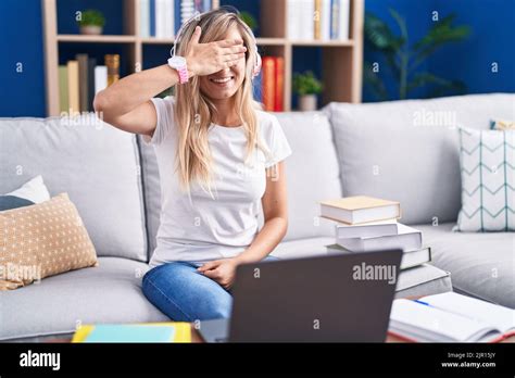 Young Blonde Woman Studying Using Computer Laptop At Home Smiling And