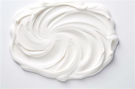 Premium Photo A White Cream Of Whipped Cream Is Covered In Whipped Cream