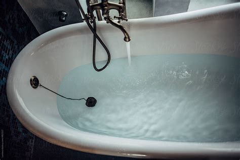 Bathtub Being Filled With Water By Stocksy Contributor Lumina Stocksy