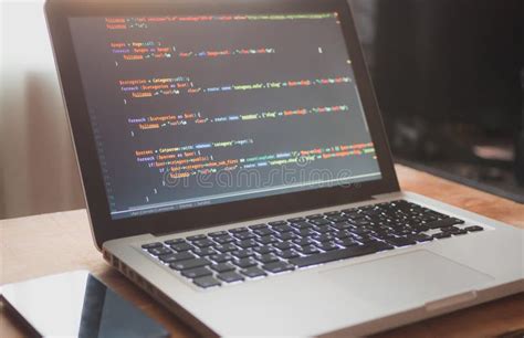Computer Code On Laptop Web Developing And Cellphone Stock Image