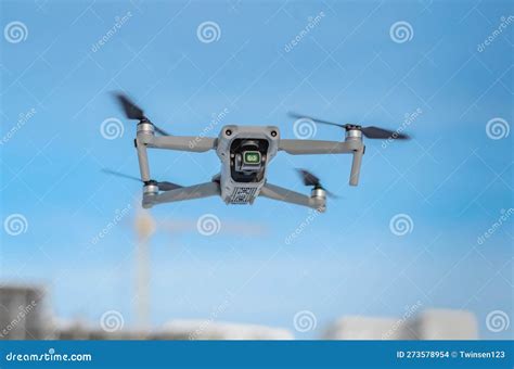The Drone Flies Against A Blue Sky Aerial Reconnaissance In Ukraine