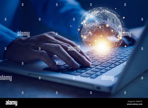 Businessman Hands Typing Notebook Laptop With Virtual Global Hologram