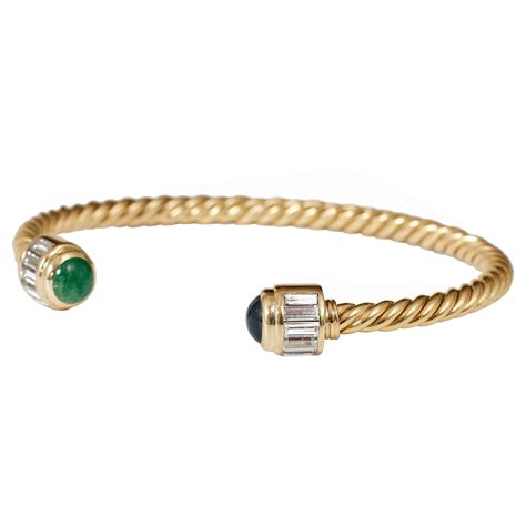 1970s Bvlgari Emerald Sapphire And Diamond 18k Yellow Gold Slave