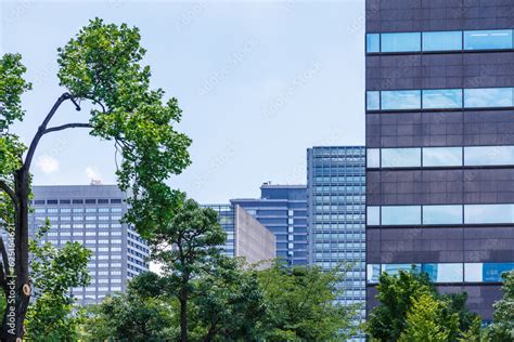 綺麗な青空と都会のビル Stock Photo Adobe Stock
