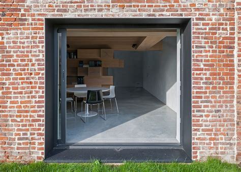 Stacked Beams Form Jenga Like Workspace Inside Former Barn In Belgium
