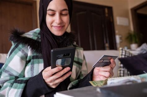 Premium Photo Muslim Woman Wearing Hijab Paying Online Through Mobile