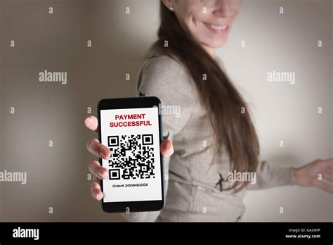 Girl Smiling Showing QR Code Successful Payment Via Smartphone In Hand Stock Photo Alamy
