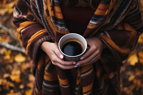 Premium Ai Image Autumn Tea Delight Woman Savoring Black Tea