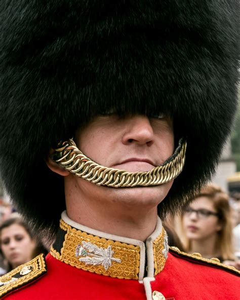 Why British Guards Wear Bearskin Hat Straps Below Their Lip Why